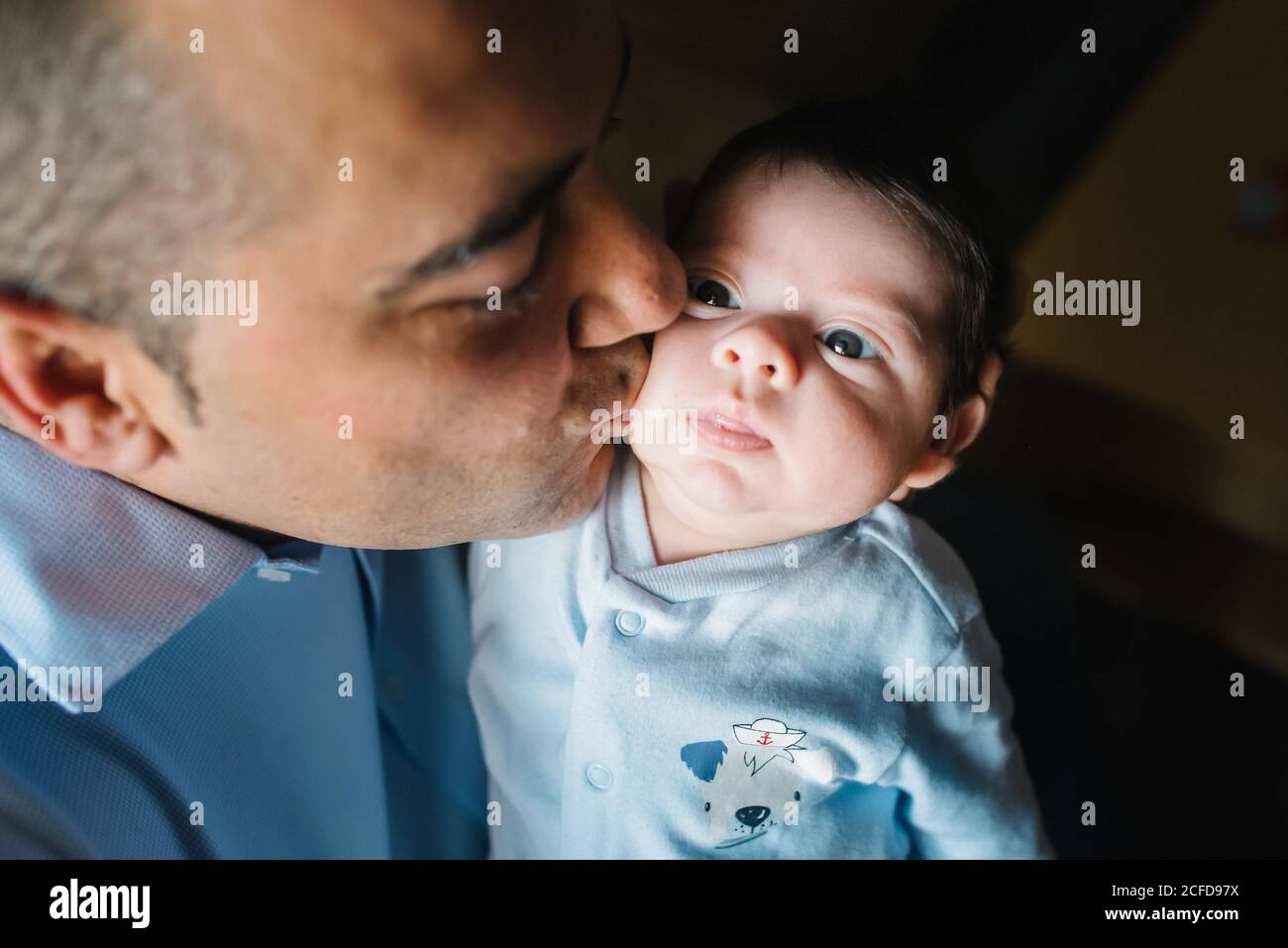 father hugging and kissing cute little baby at home Stock Photo - Alamy