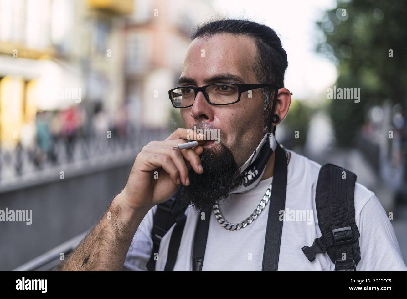 Shallow focus shot of Caucasian male smoking outdoors Stock Photo - Alamy