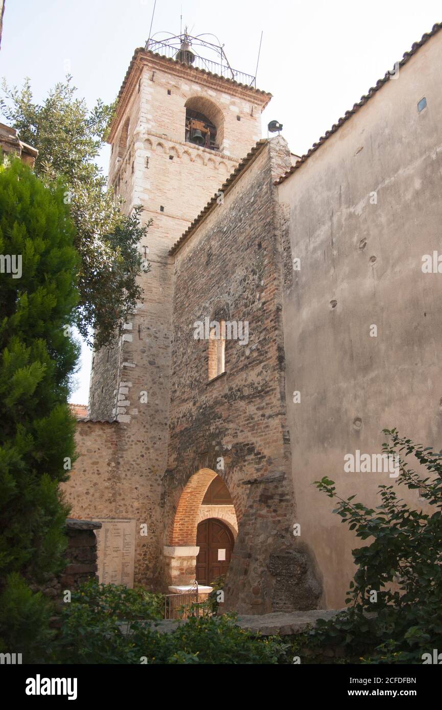 The arch of the gate let the sunshine in. The bell tower of the St ...