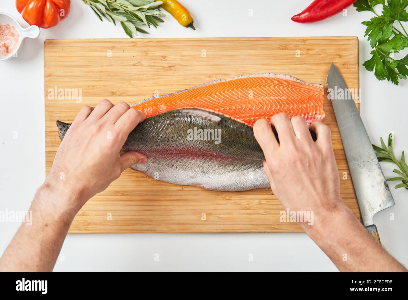 Process of butchering of fresh fish Stock Photo - Alamy