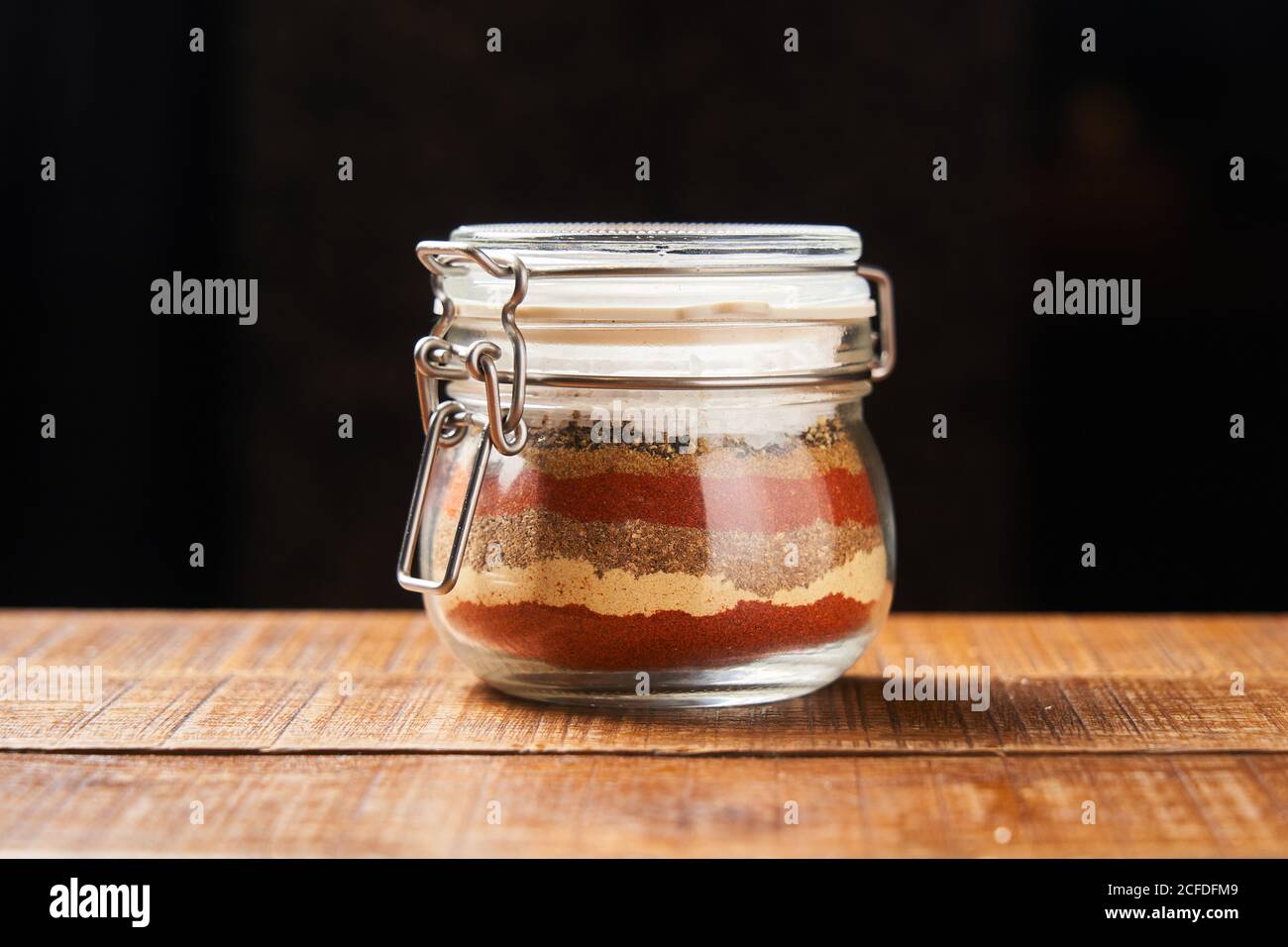 Layers of colorful spices in jar Stock Photo - Alamy