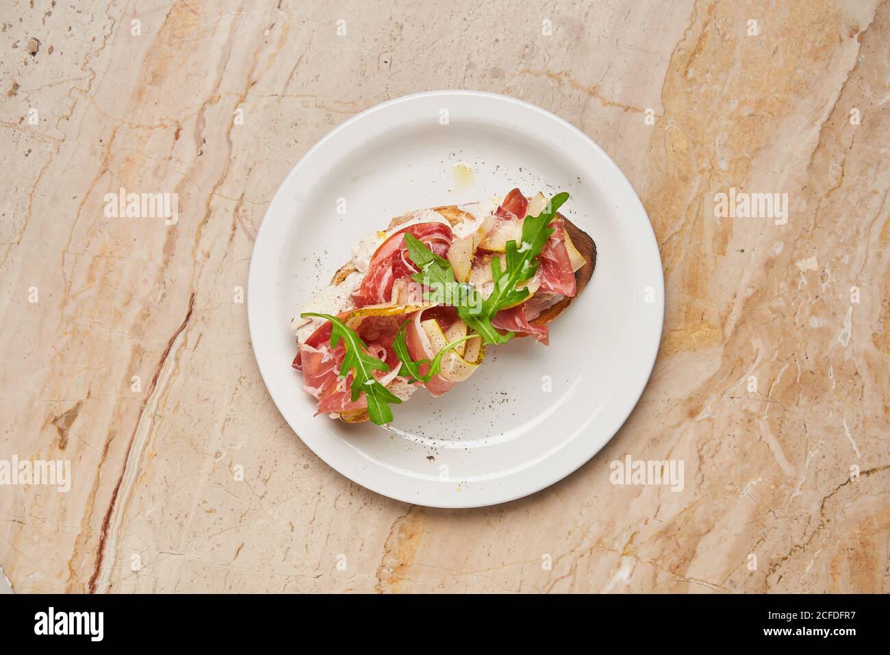 Open sandwich with ham and pear Stock Photo - Alamy