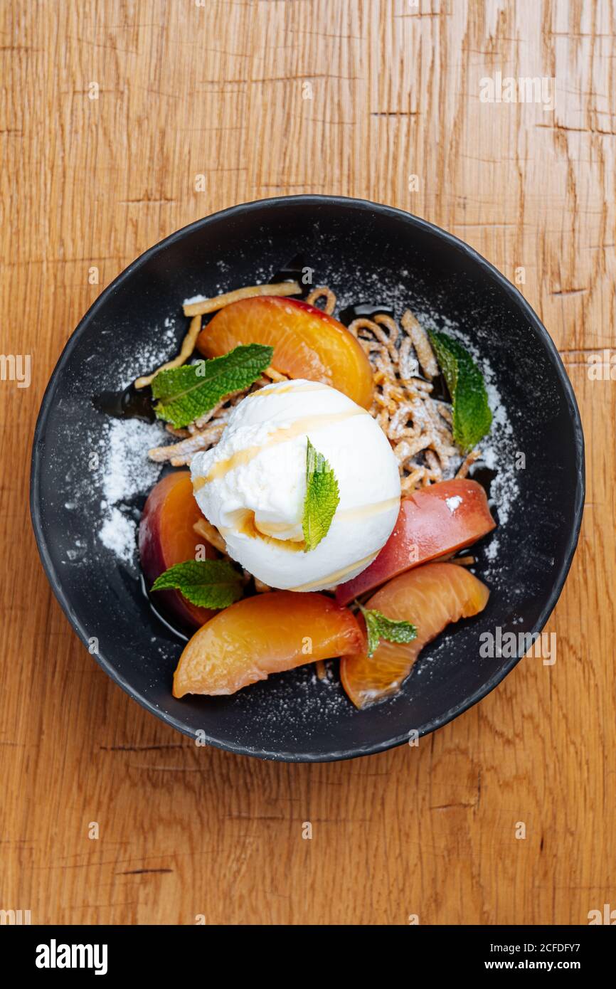 High cuisine modern dessert with ice cream and fruit Stock Photo - Alamy