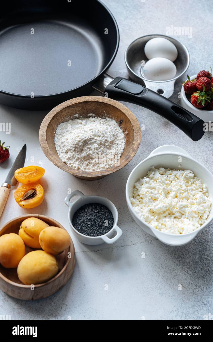 Dessert ingredients around frying pan Stock Photo - Alamy