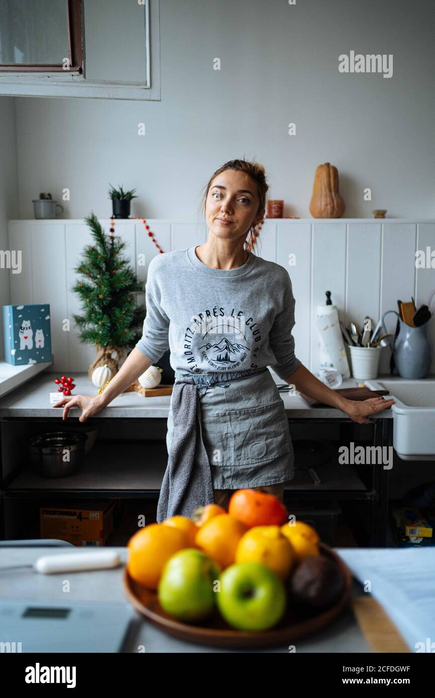 Leaning on counter hi-res stock photography and images - Alamy