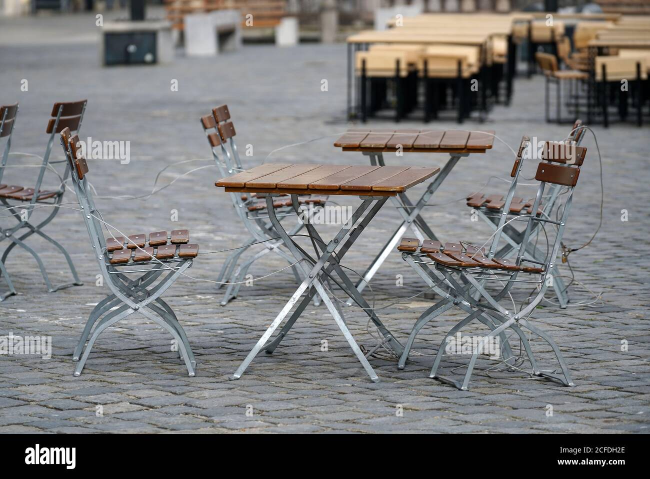 Outdoor cafe with chairs and tables Stock Photo - Alamy