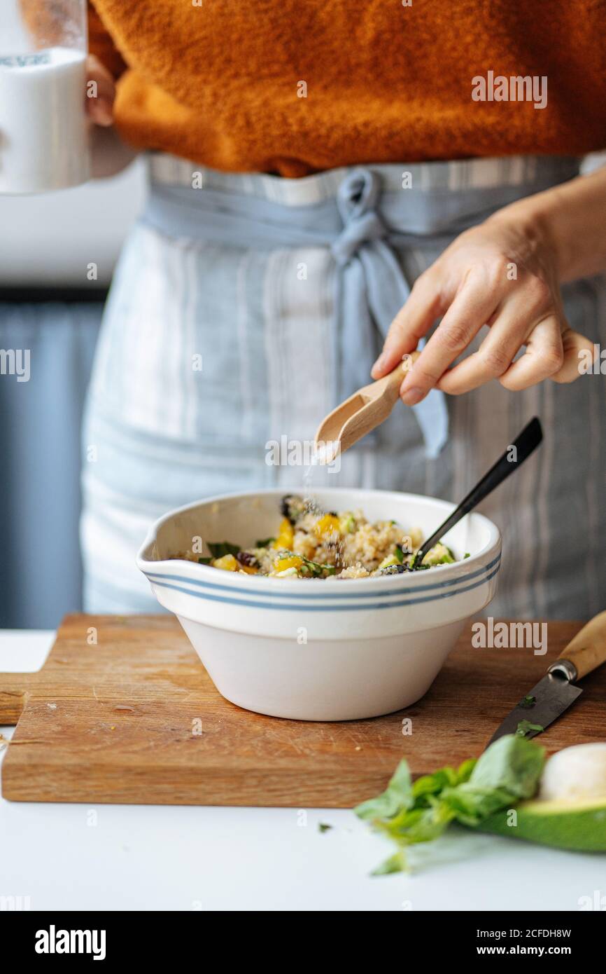 Crop female adding salt hi-res stock photography and images - Alamy