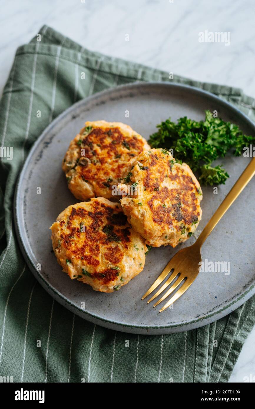 Healthy delicious grilled cutlets made from fish and vegetables served ...