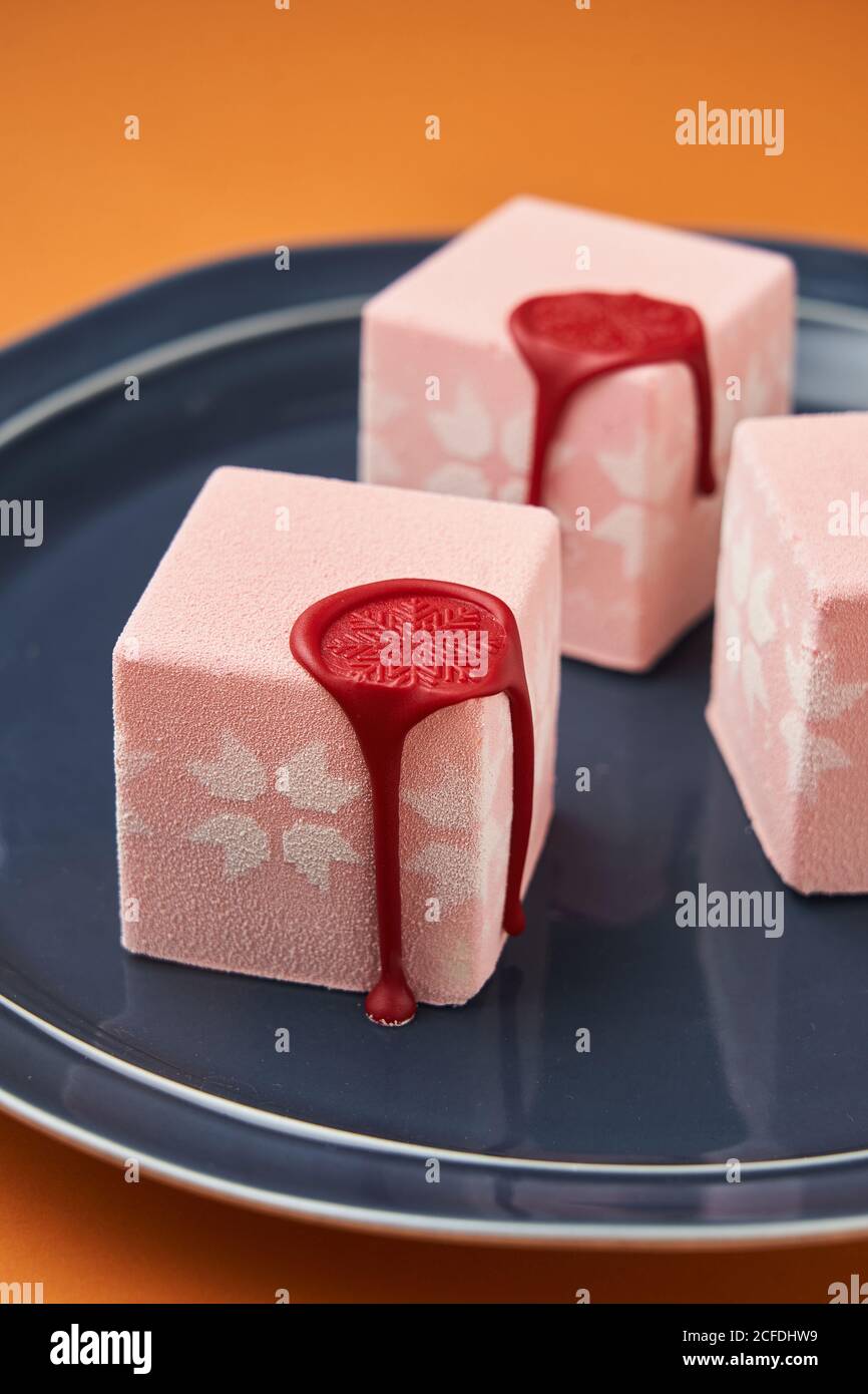 Cubical desserts with wax seals Stock Photo - Alamy