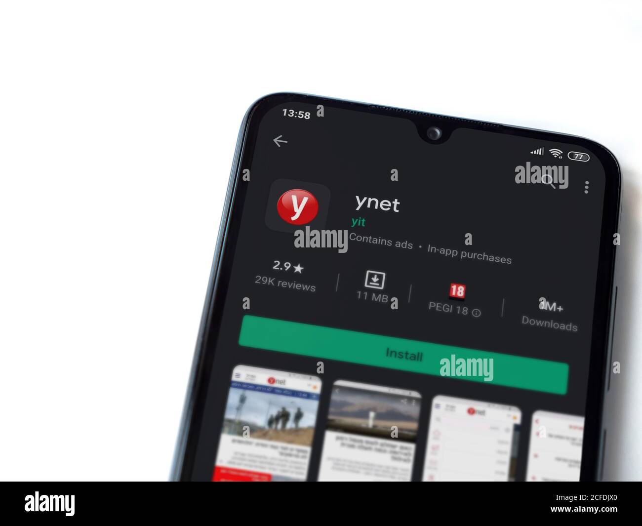 Lod, Israel - July 8, 2020: ynet app play store page on the display of a black mobile smartphone ...
