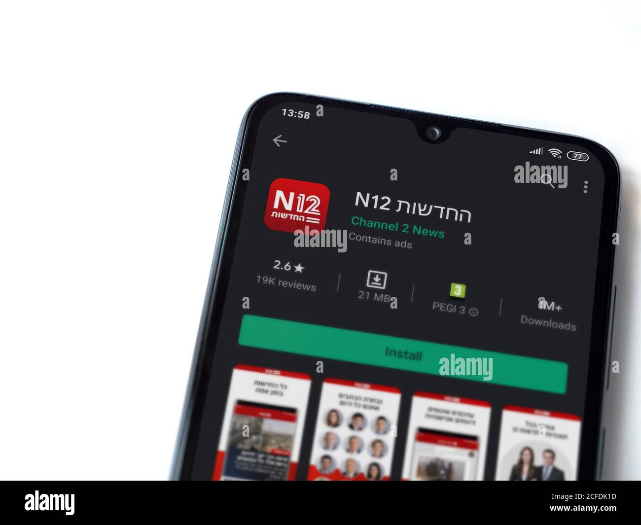 Lod, Israel - July 8, 2020: N12 app play store page on the display of a black mobile smartphone ...