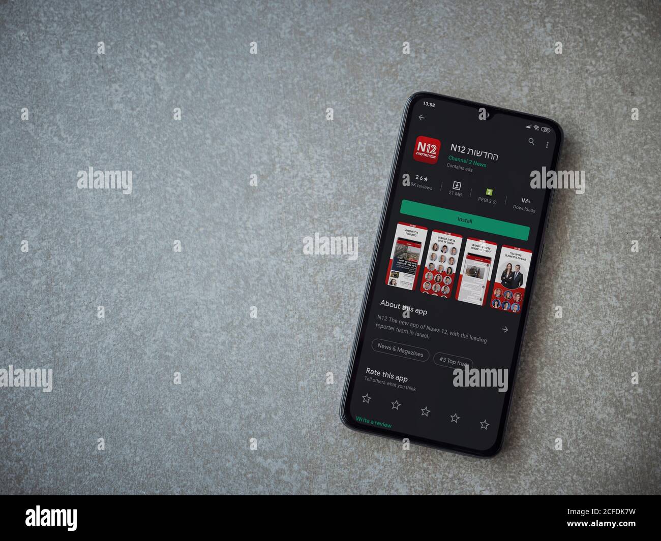 Lod, Israel - July 8, 2020: N12 app play store page on the display of a black mobile smartphone ...