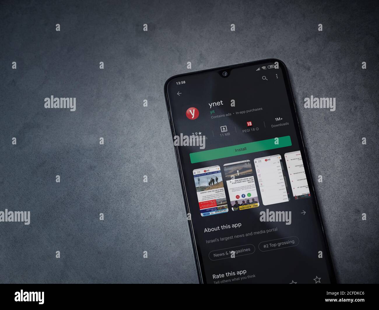 Lod, Israel - July 8, 2020: ynet app play store page on the display of a black mobile smartphone ...