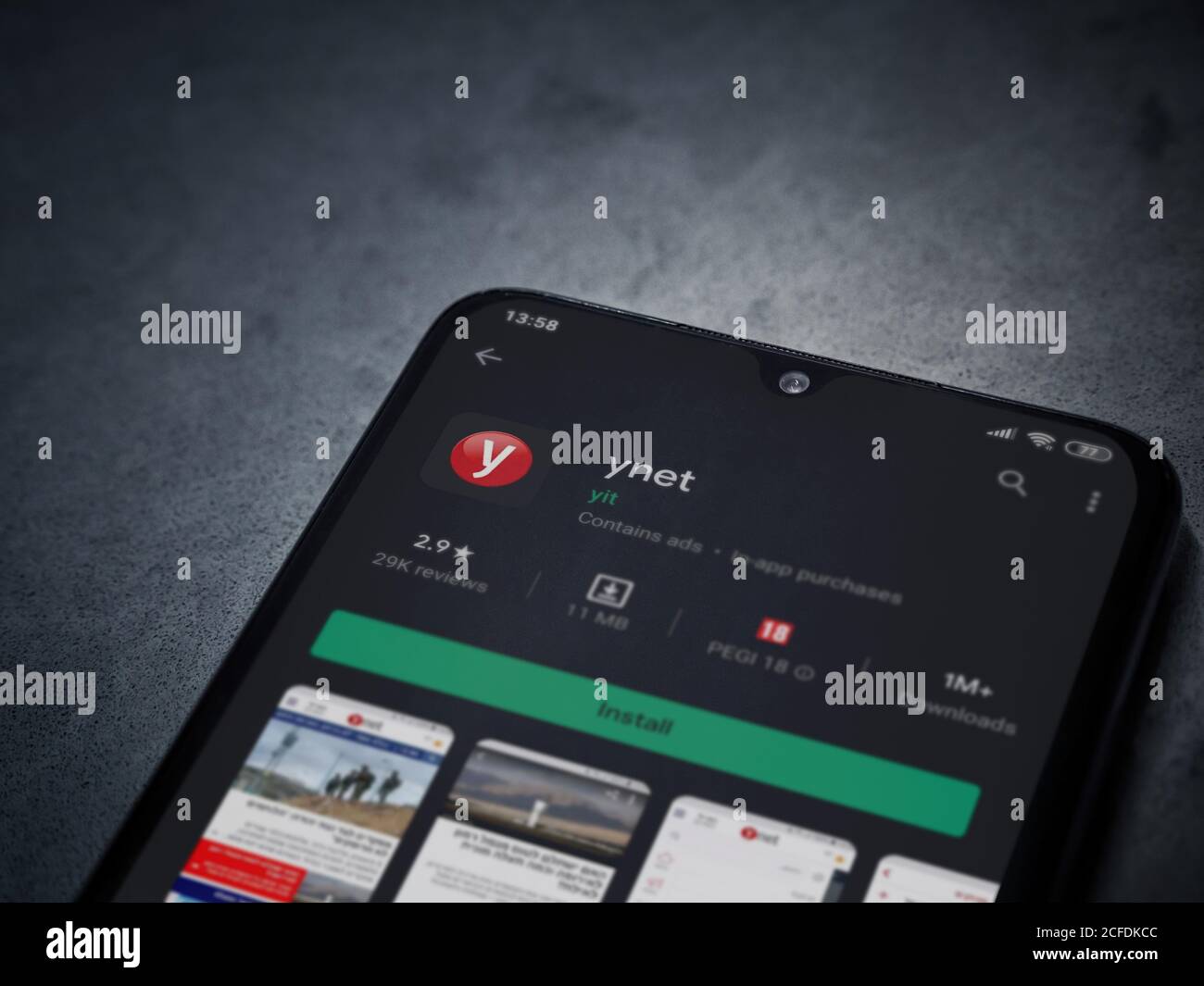 Lod, Israel - July 8, 2020: ynet app play store page on the display of a black mobile smartphone ...