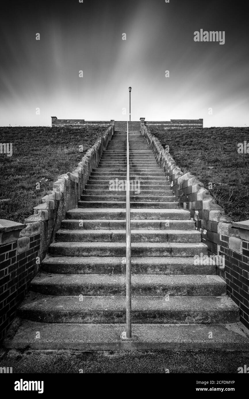 Long stone steps leading up a steep banking Stock Photo - Alamy
