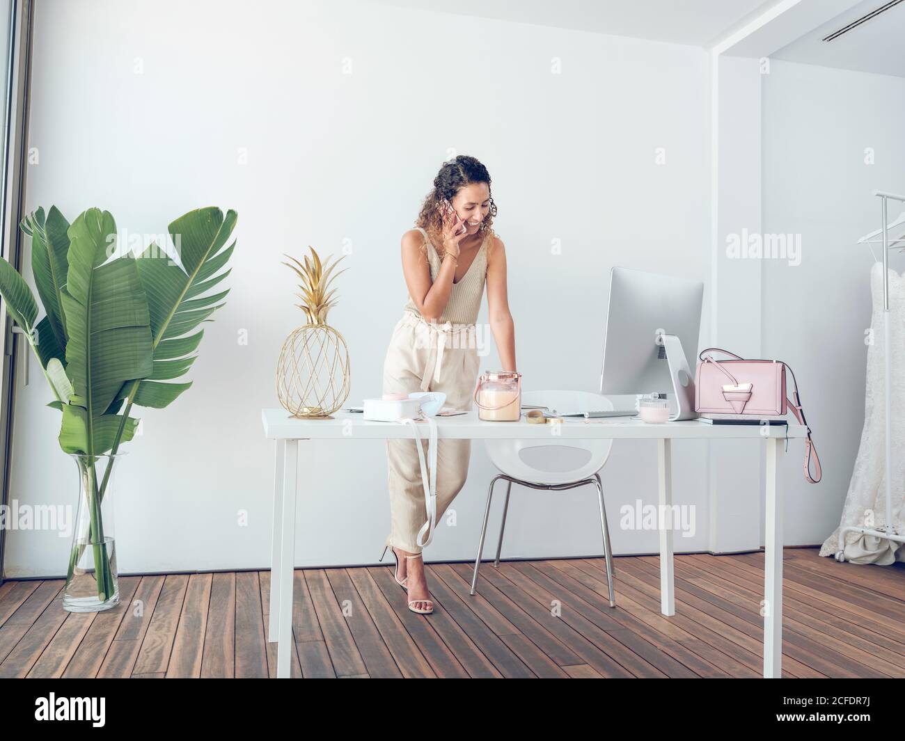 Pretty Woman in elegant outfit smiling and having phone conversation ...