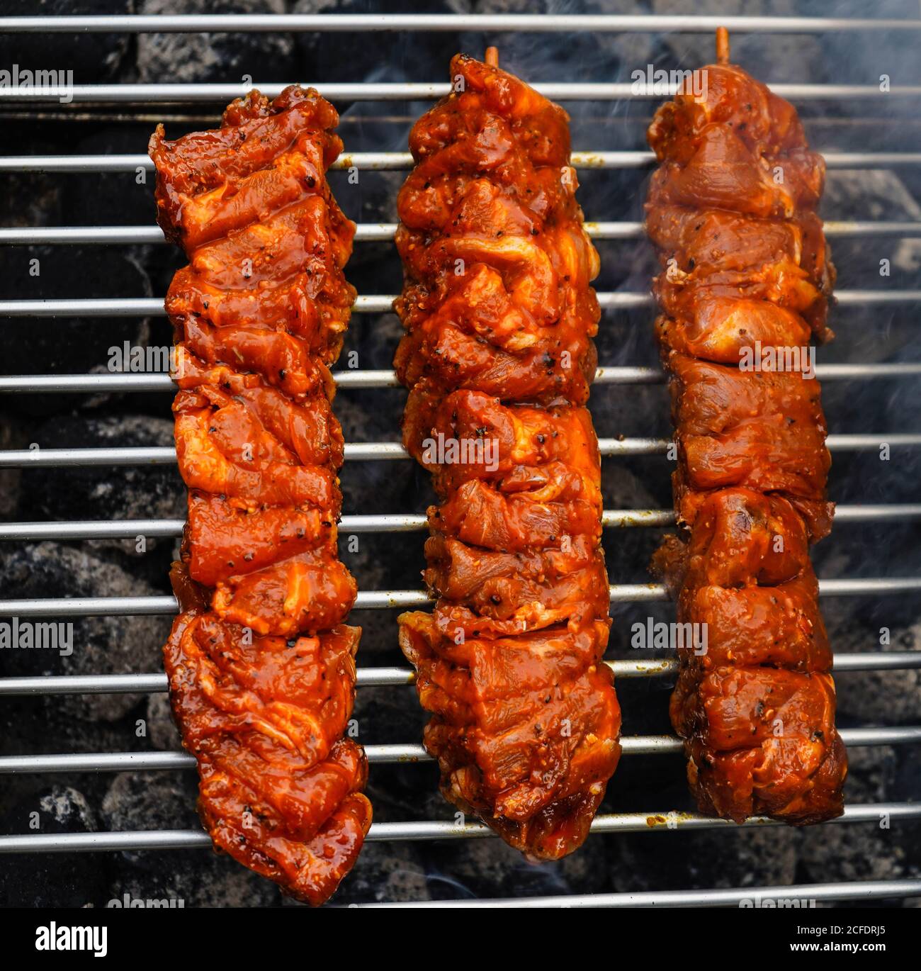 spicy meat on the grill Stock Photo - Alamy