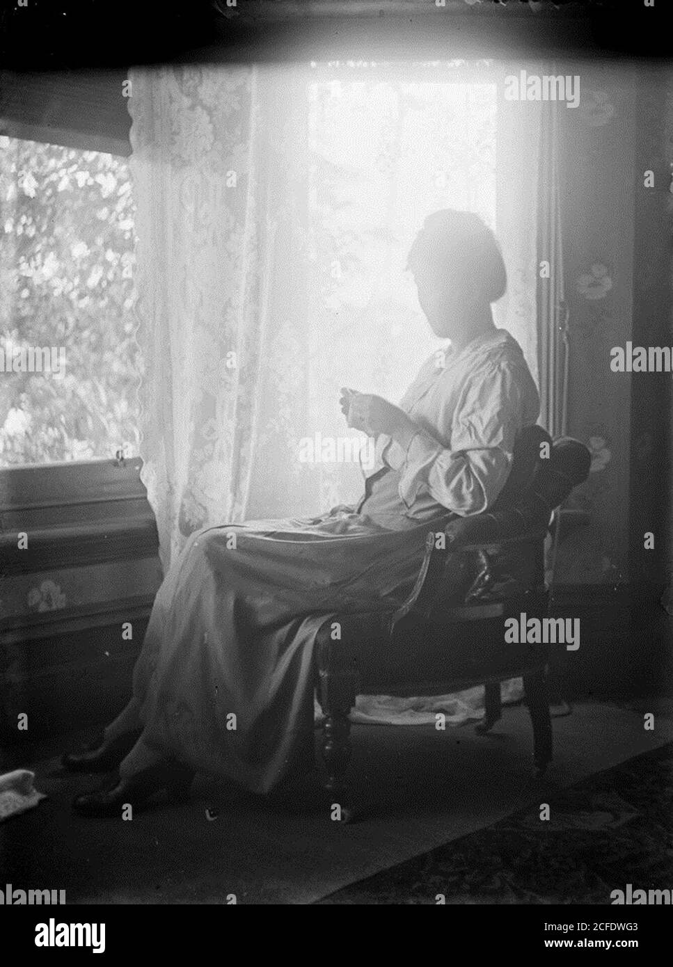 Sitting near window Black and White Stock Photos & Images - Alamy