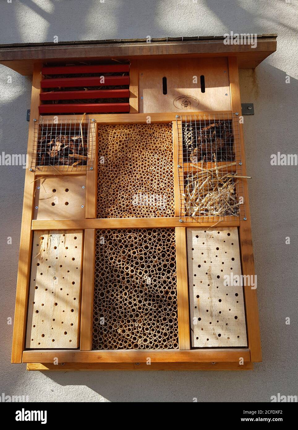 Insect hotel on a sunny wall hi-res stock photography and images - Alamy