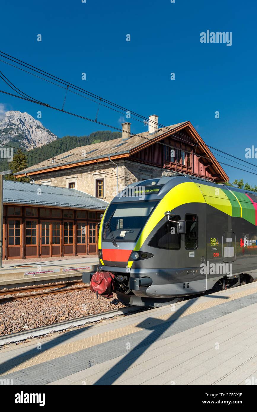 Toblach, South Tyrol, Bolzano province, Italy. A flirt train of the ...