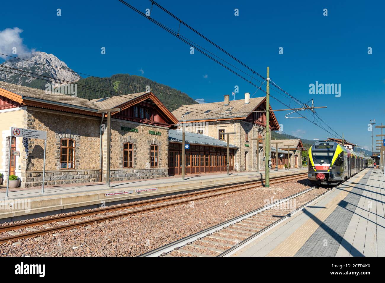 Toblach, South Tyrol, Bolzano province, Italy. A flirt train of the ...