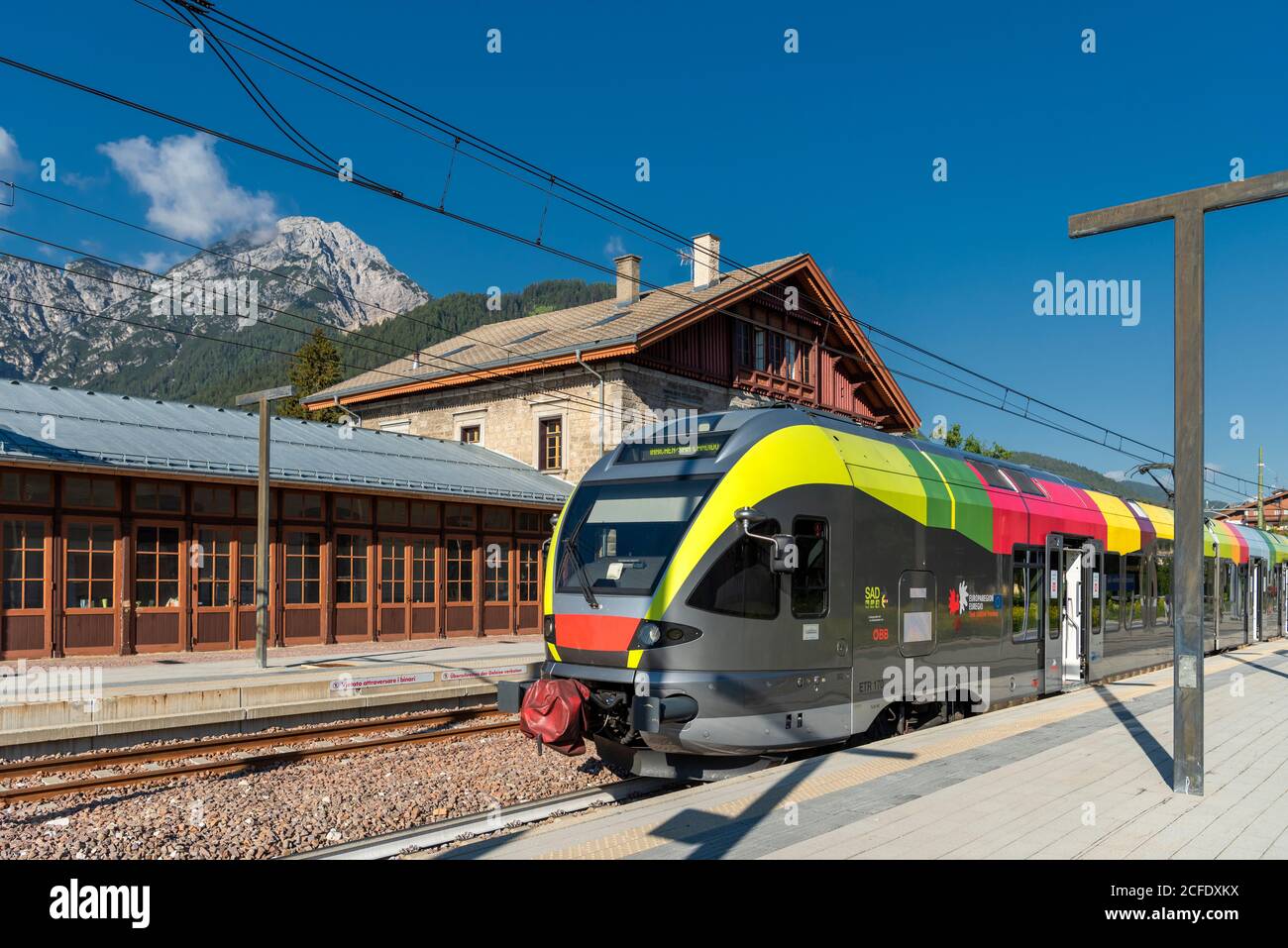 Toblach, South Tyrol, Bolzano province, Italy. A flirt train of the ...