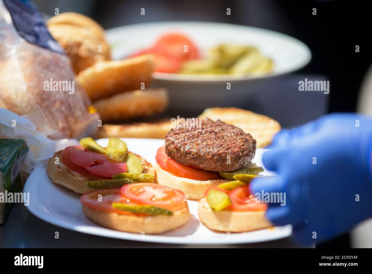 Burger making process hi-res stock photography and images - Alamy