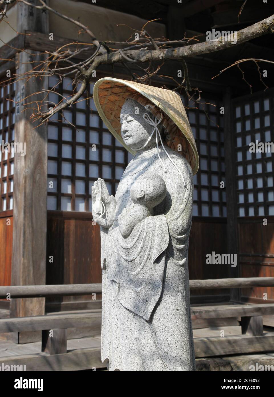 A religious statue outside a traditional Japanese Temple in Takayama ...