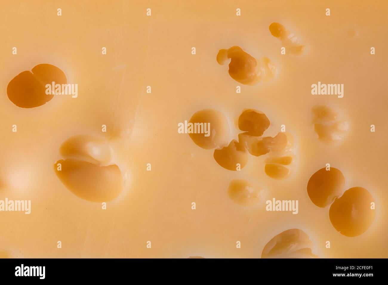 Cheese texture with large holes Stock Photo - Alamy