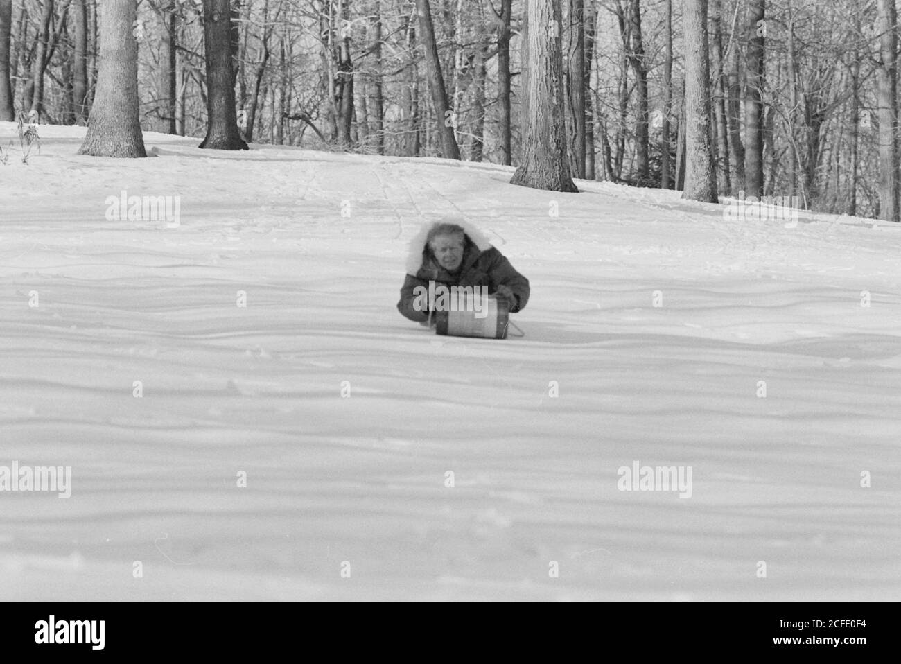 Jimmy Carter sledding at Camp David ca. 4 February 1978 Stock Photo - Alamy