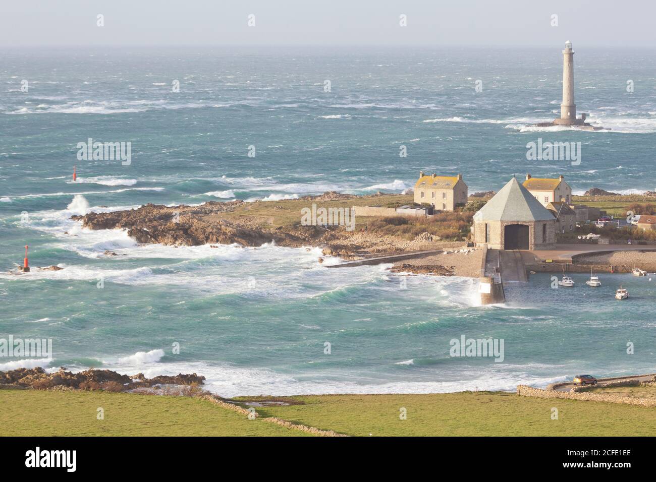 Goury lighthouse and harbor during a storm on the northern tip of the ...
