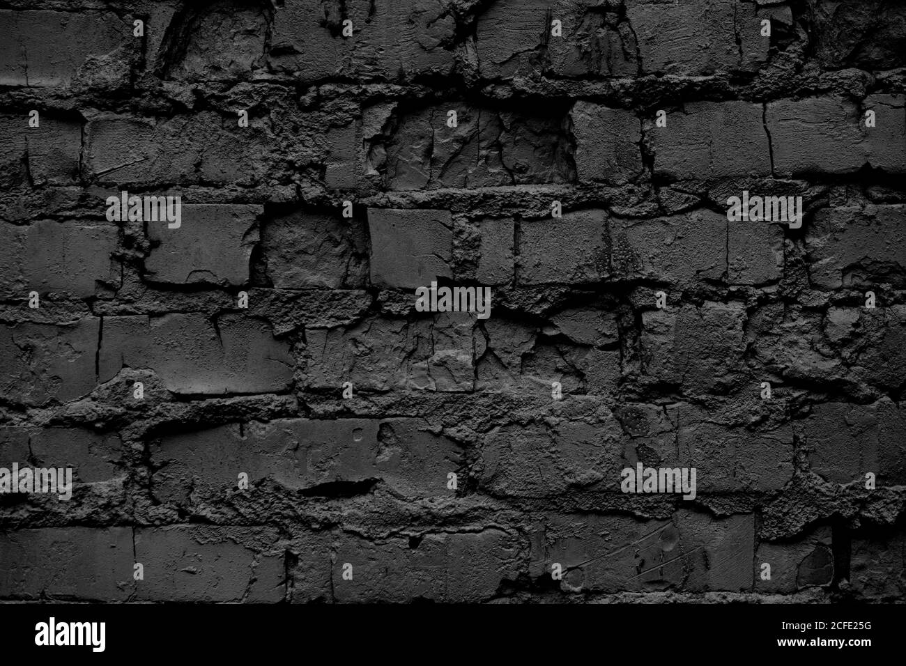 Black brick wall close up. Rough background Stock Photo - Alamy