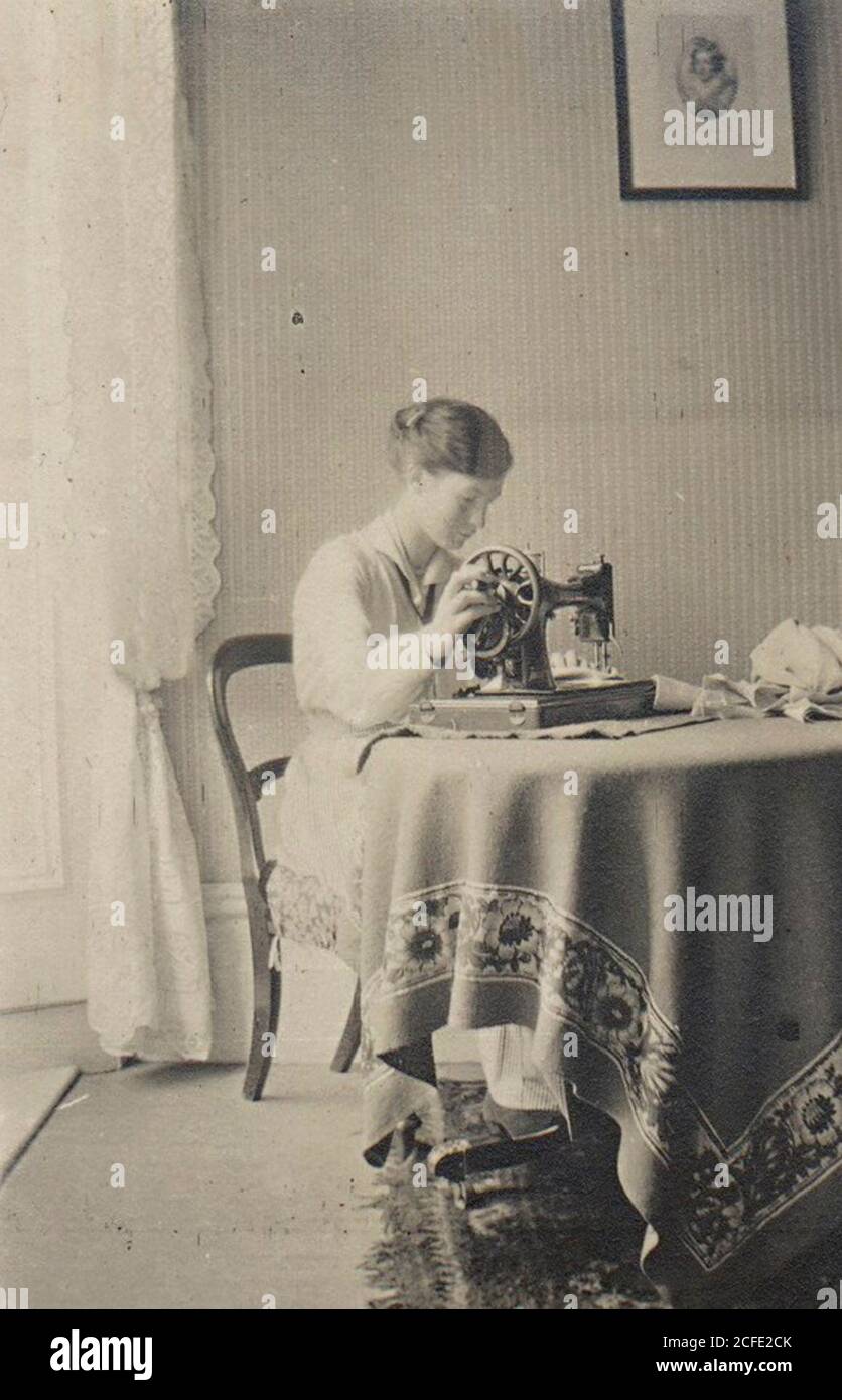 Postcard woman sewing machine hi-res stock photography and images - Alamy