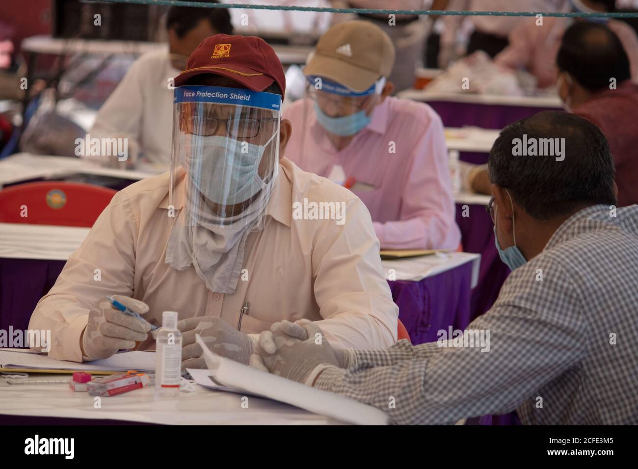 Health workers wearing PPE kit, Face shield & mask Stock Photo - Alamy