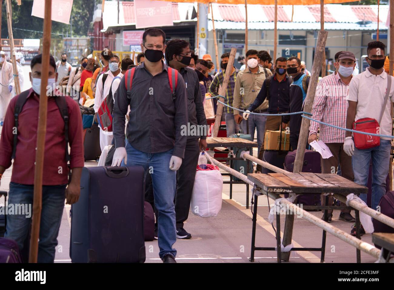 Migrant people returning to their home from different states due to ...