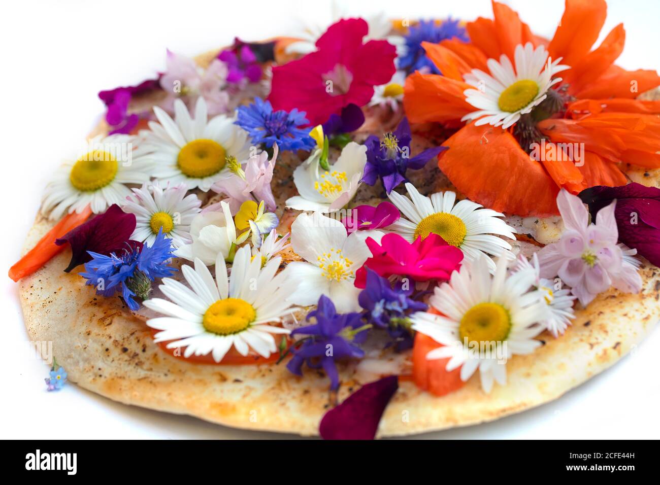 Creative pizza covered with colorful flowers Stock Photo - Alamy