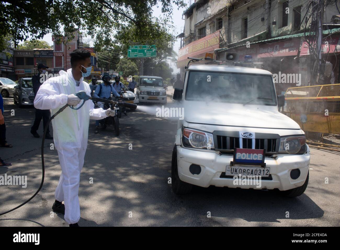Dehradun, Uttarakhand/India- August 15 2020: policemen sanitizing ...