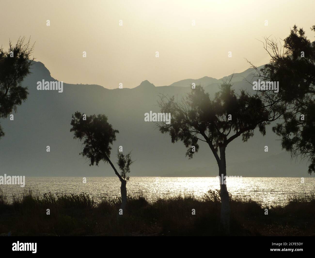 Romantic golden sunset over Mediterranean Sea, Crete island. Dark ...