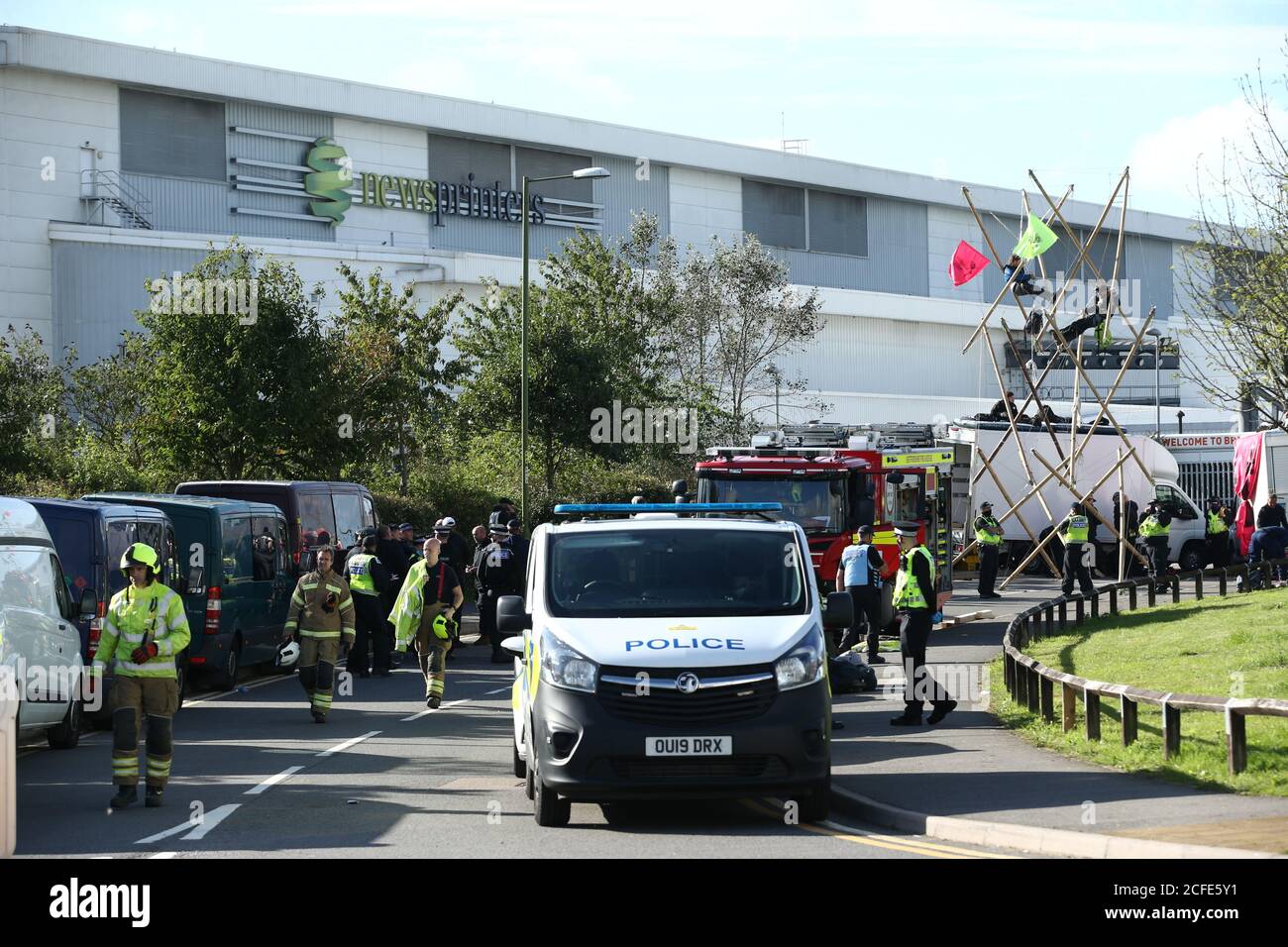 Protesters continue to use lock ons vans to block the road hi-res stock ...