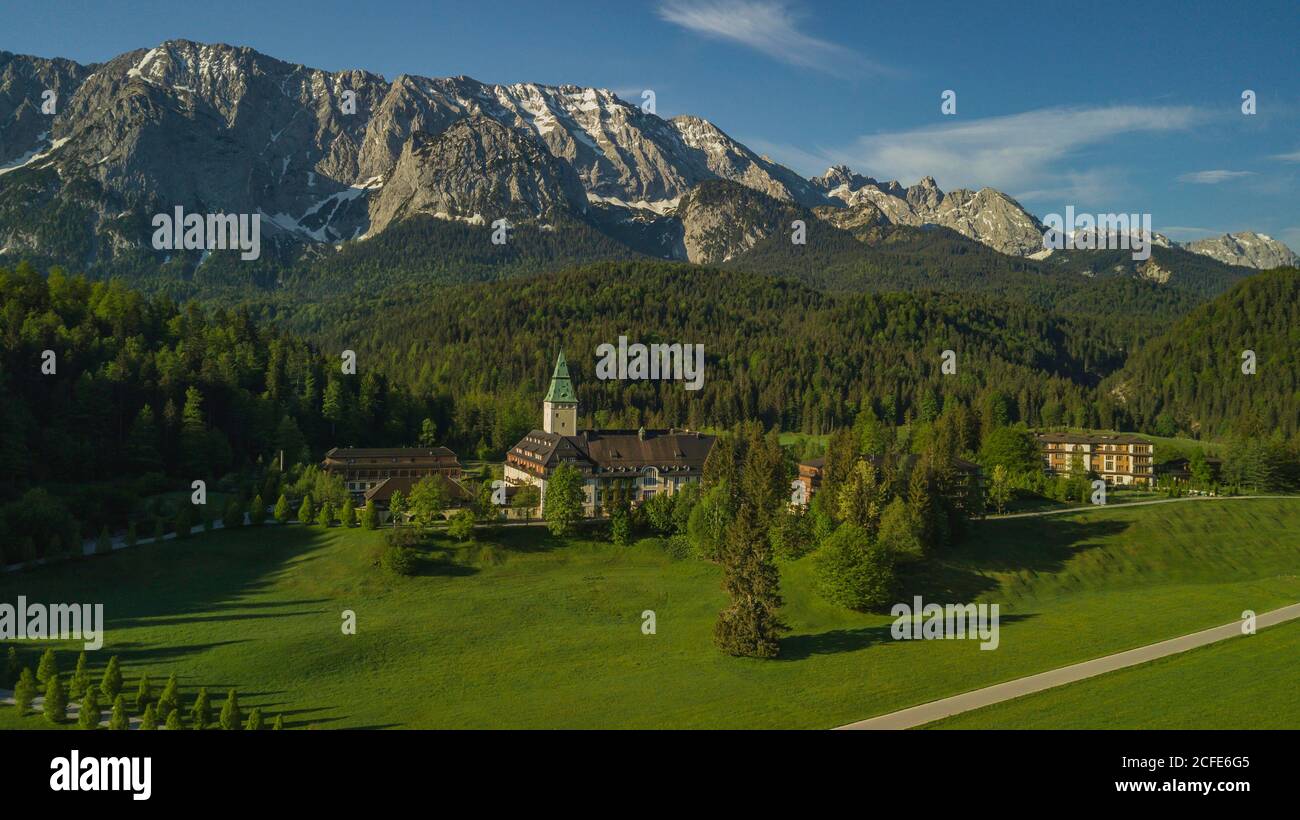 Elmau Castle in spring, aerial view with a view towards the Wetterstein ...