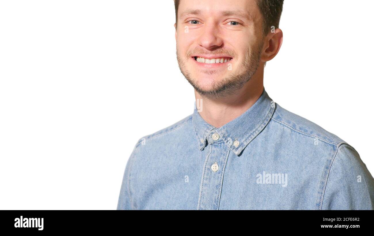 young handsome man looking happy and goofy with a broad, fun smile on ...