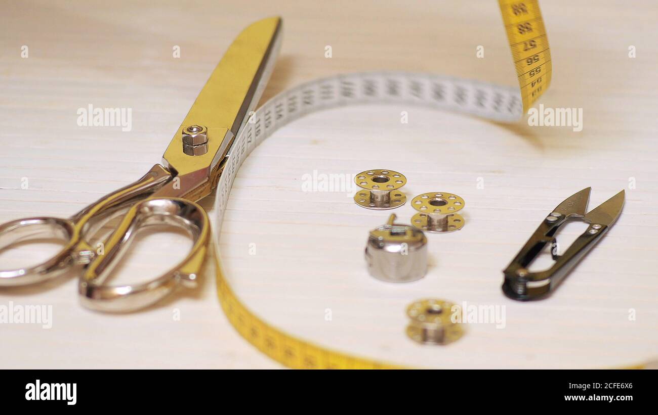 Tailor tools isolated on wooden background. Scissors, needle, Tailoring ...