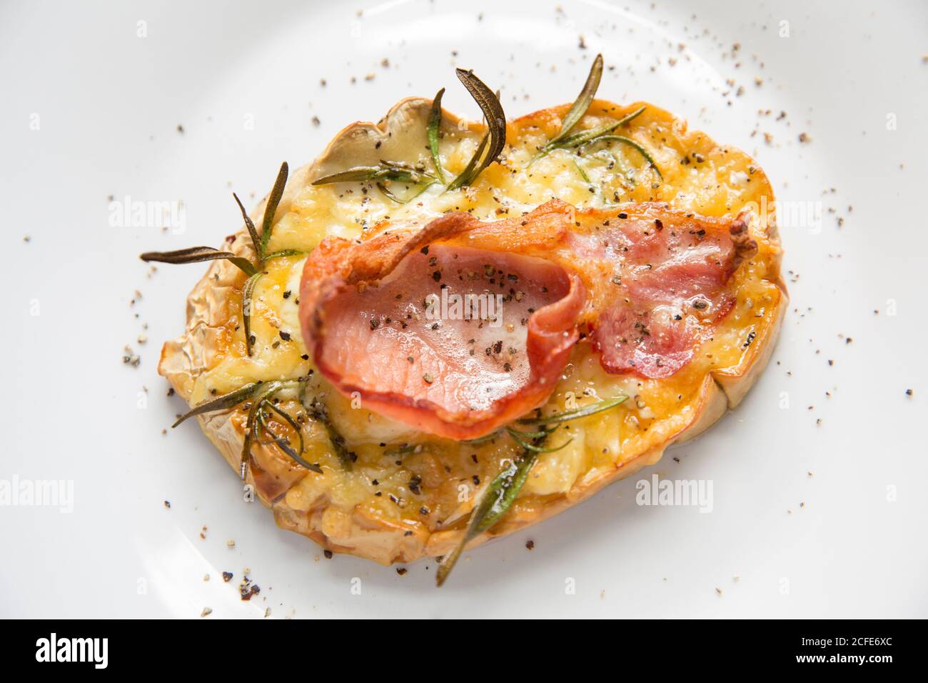 A slice of a giant puffball, Calvatia gigantea, that has been grilled ...