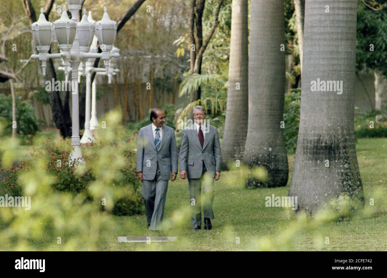 Jimmy Carter and President Carlos Perez tour the grounds at La Casona ...