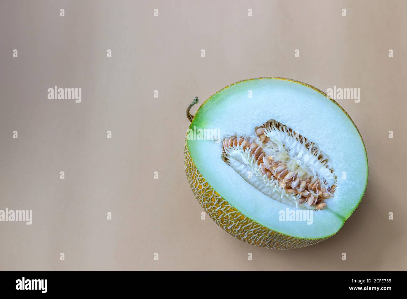 Fresh sweet melon on beige background, top view Stock Photo - Alamy
