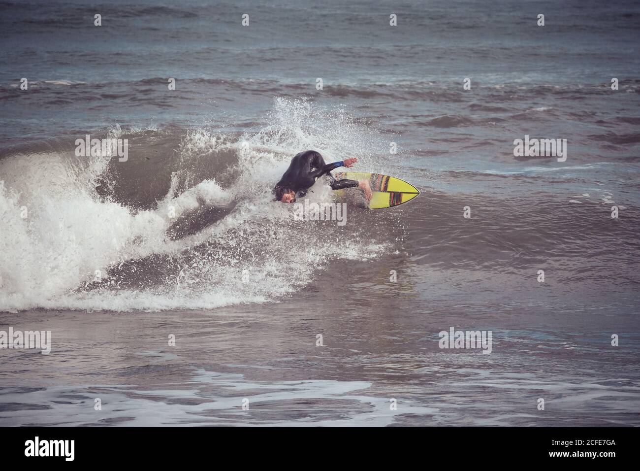 man on surf board on water wave Stock Photo - Alamy