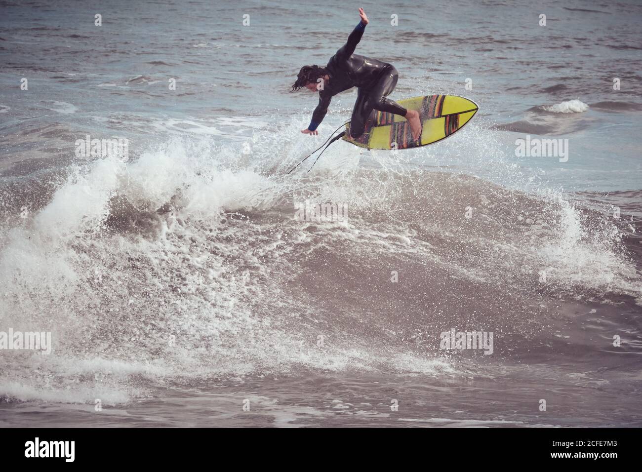 man on surf board on water wave Stock Photo - Alamy