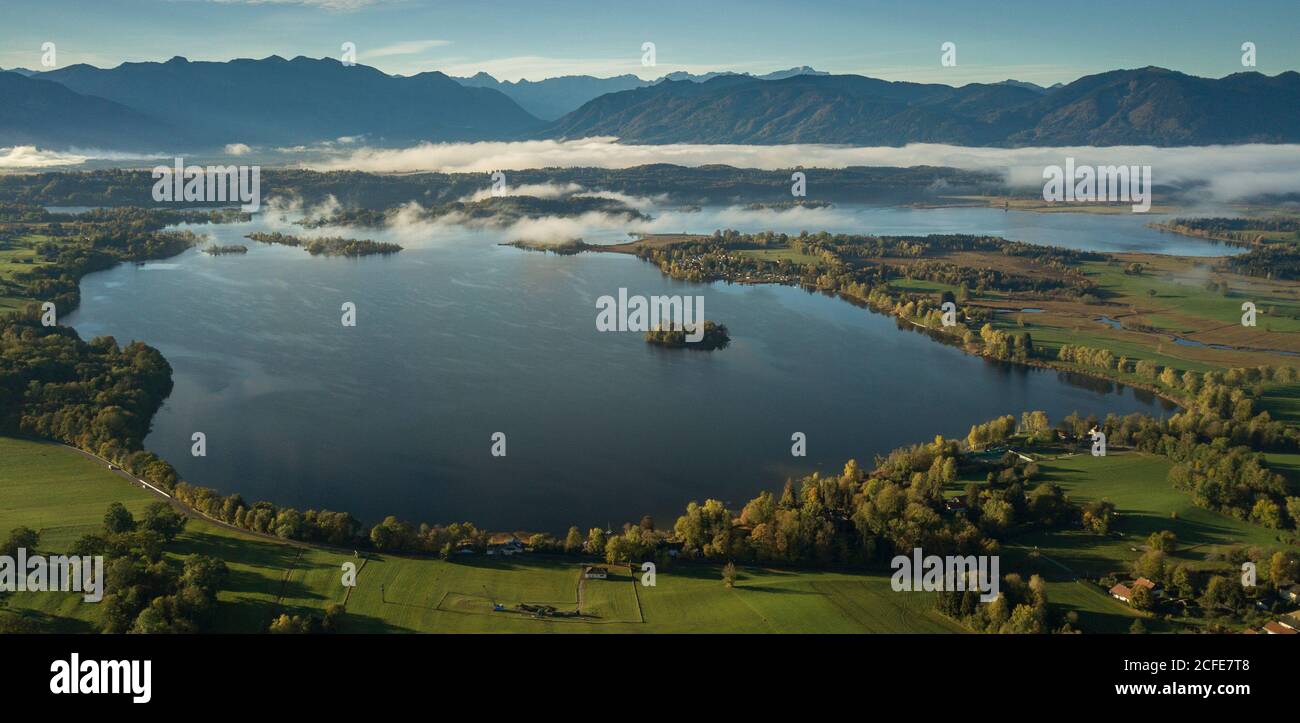 Aerial view Staffelsee in autumn fog with the island of Mühlwörth ...