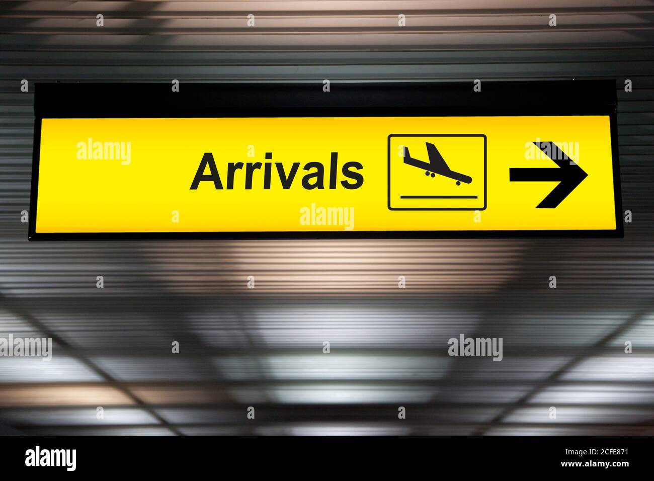 Airport arrival sign hanging from airport ceiling Stock Photo - Alamy