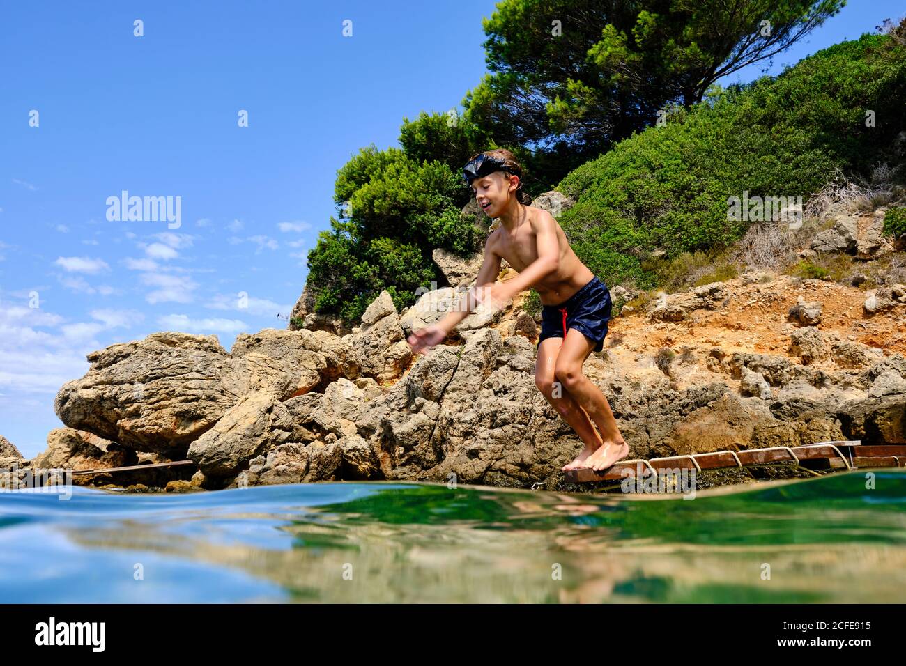Getting ready to dive into water High Resolution Stock Photography and ...